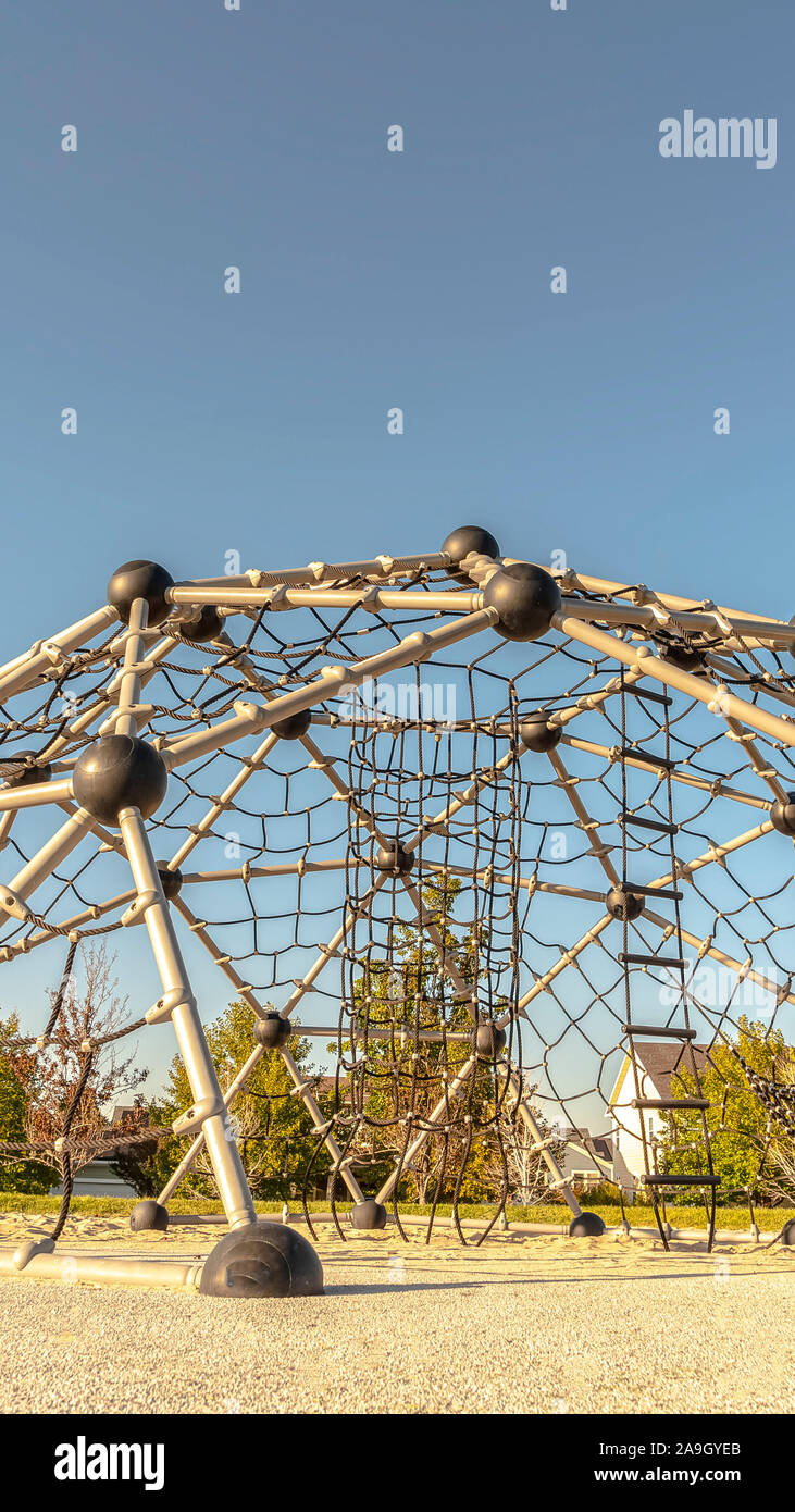 Vertical Climbing dome with nets in a kids playground Stock Photo - Alamy