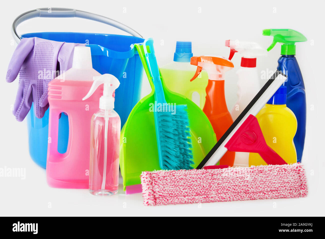 Various cleaning products and household supplies on white backgr Stock ...