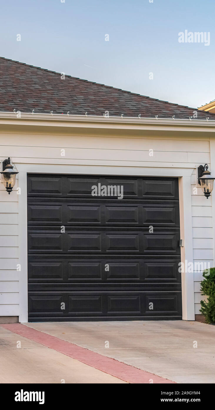 Vertical Double garage unit attached to a suburban house Stock Photo ...