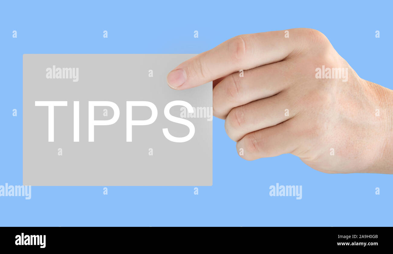 Label tipps with femal hand Stock Photo - Alamy