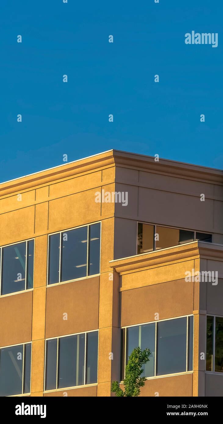 Vertical frame Facade of a commercial building with large glass windows ...