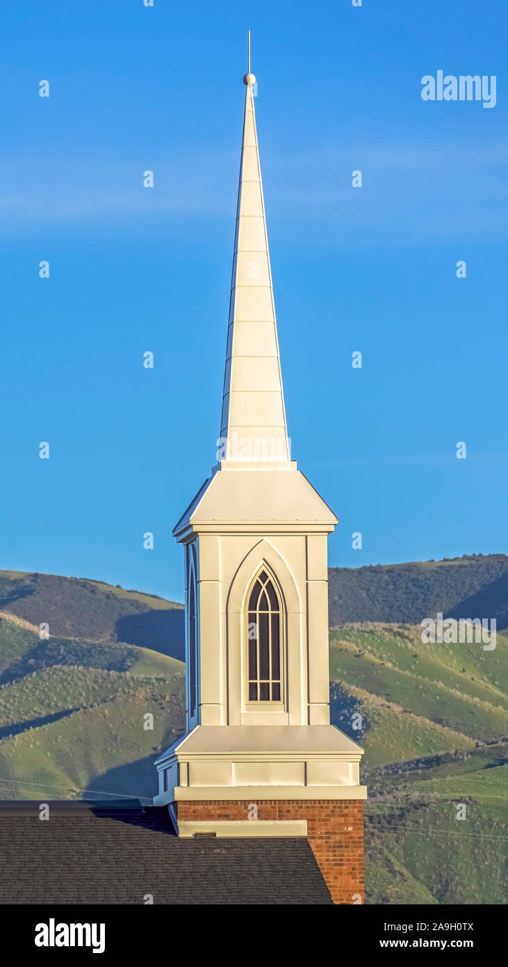Vertical frame Focus on the roof and steeple of a church with classic ...