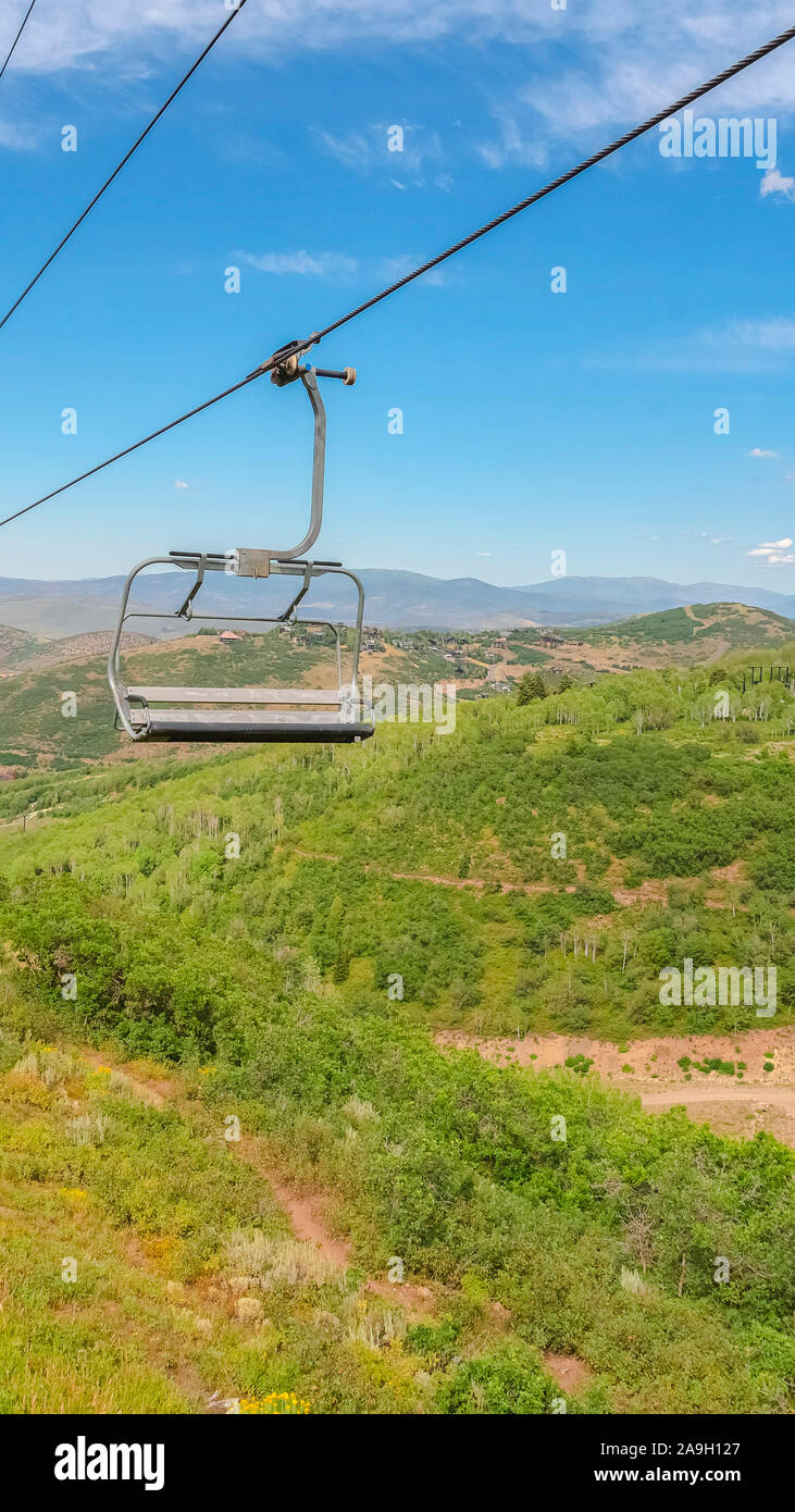Vertical frame Hiking trails and vibrant foliage under chairlifts and ...