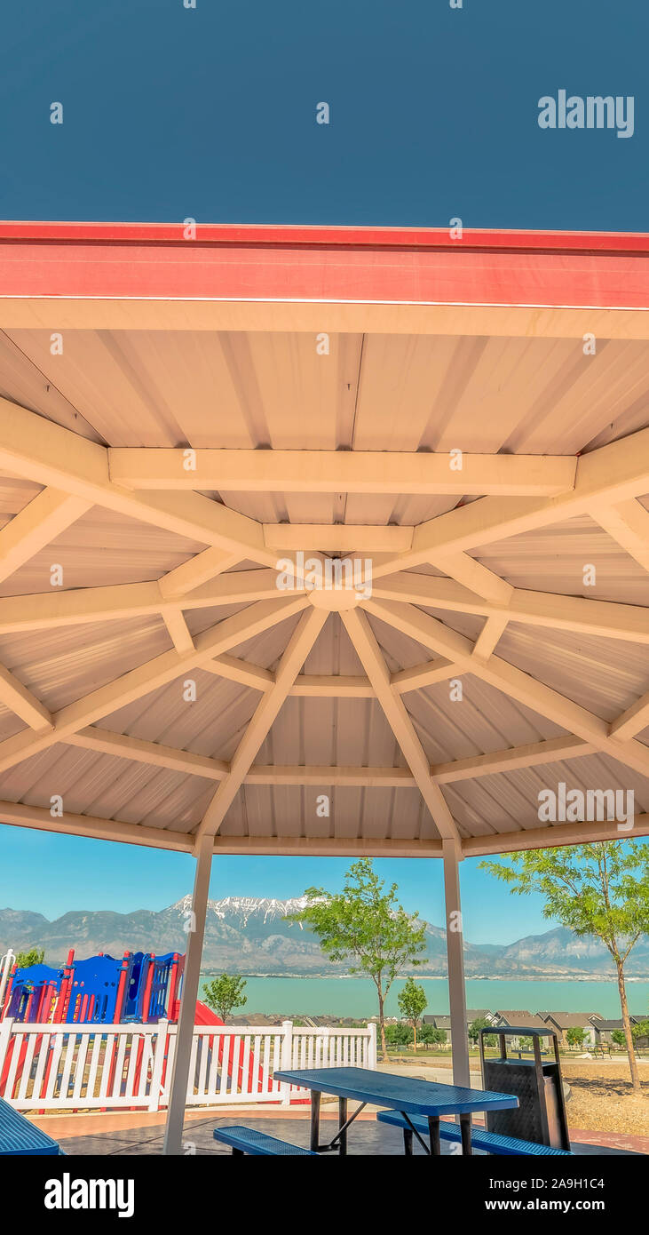 Vertical frame Octagon shape pavilion and playground with lake and ...