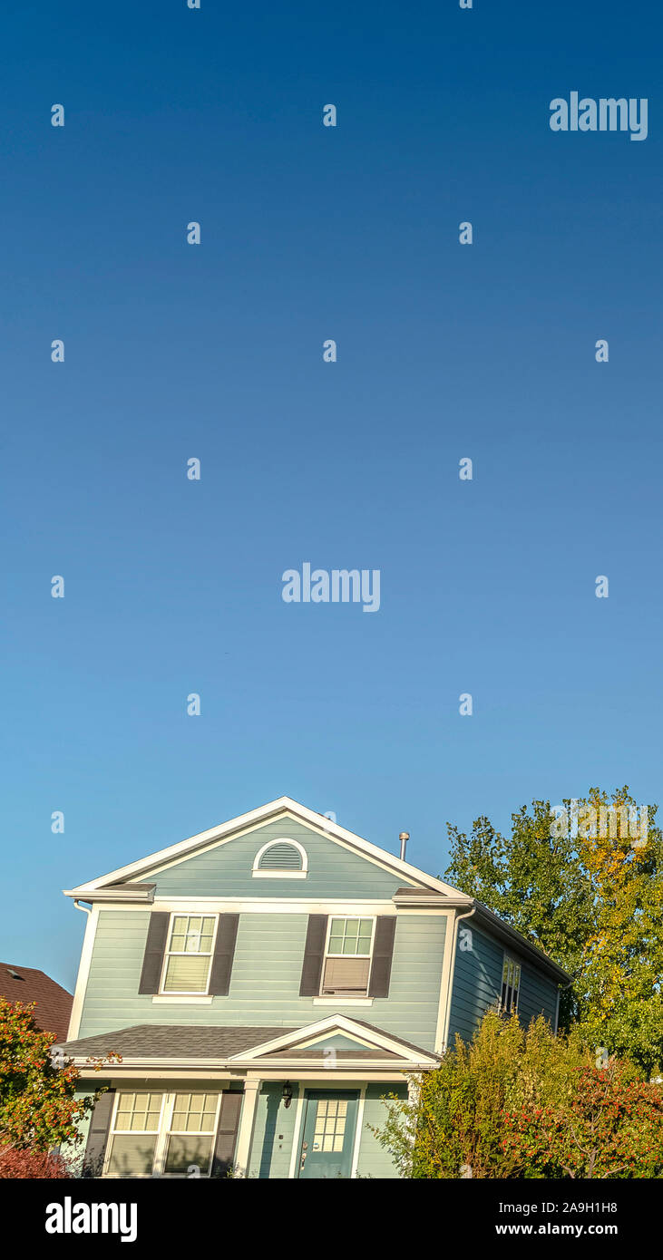 Vertical frame Row of three houses on a modern urban estate Stock Photo ...