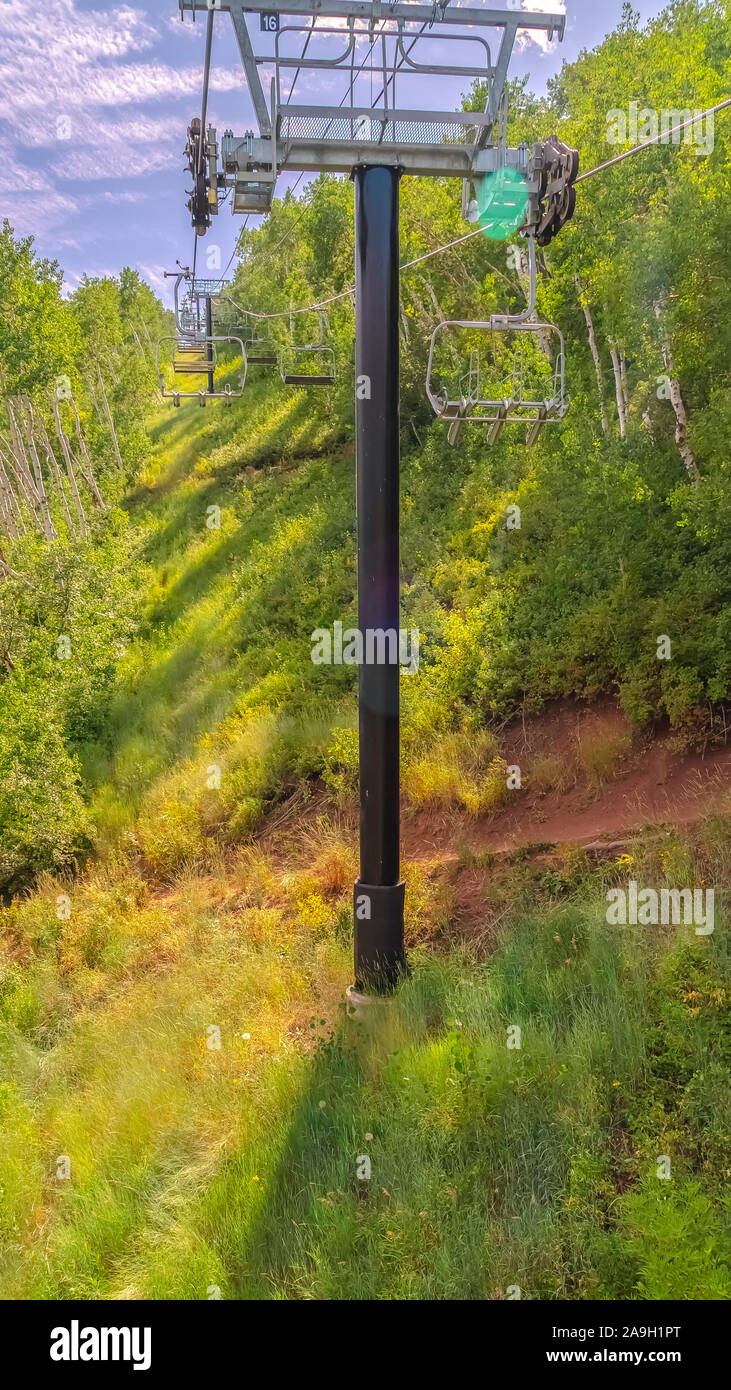 Vertical frame Ski resort mountain landscape with chairlifts and hiking ...