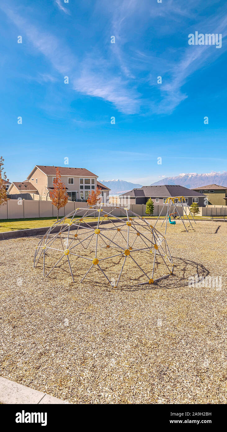 Vertical Kids playground with climbing dome in urban park Stock Photo ...