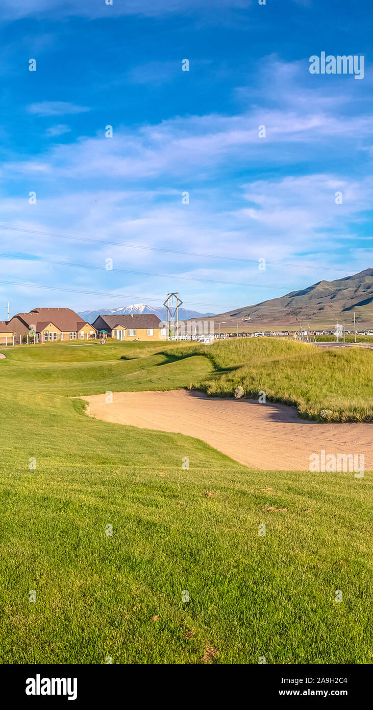 Vertical Long meandering sand trap on a golf course Stock Photo - Alamy