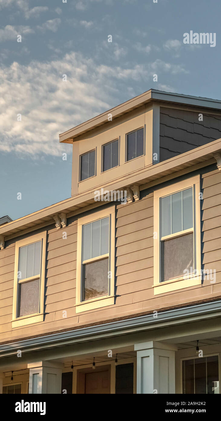 Vertical Sash windows in the upper floor of a timber house Stock Photo ...