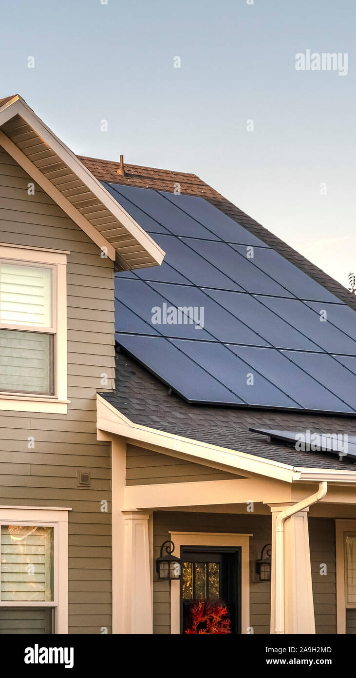 Vertical Solar photovoltaic panels on a house roof Stock Photo - Alamy