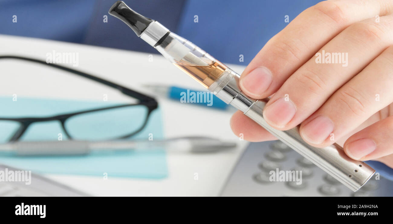 E-cigarette electric smoking and male hand Stock Photo - Alamy