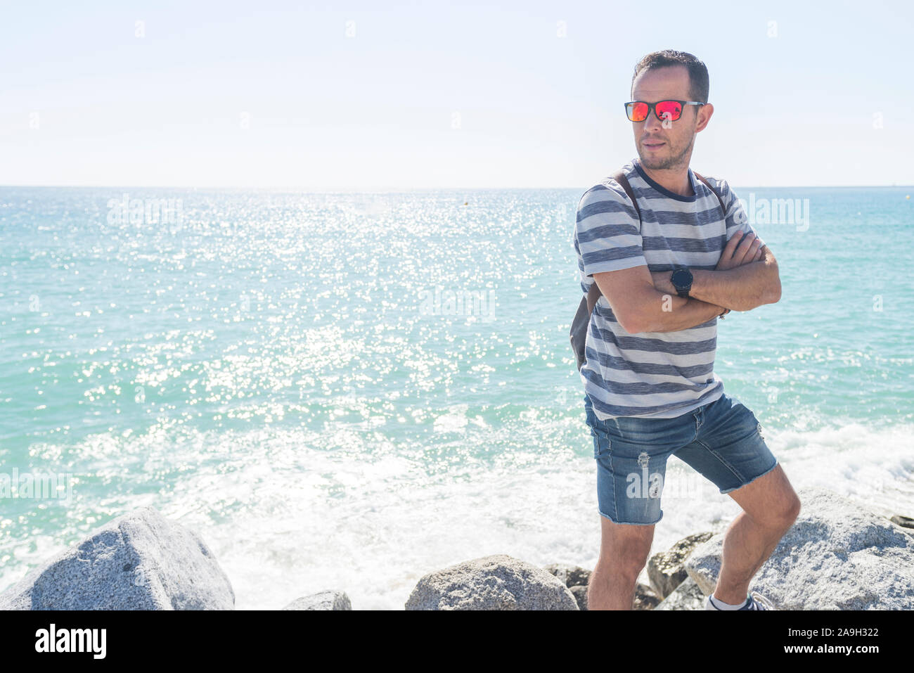 Man standing by the sea hi-res stock photography and images - Alamy