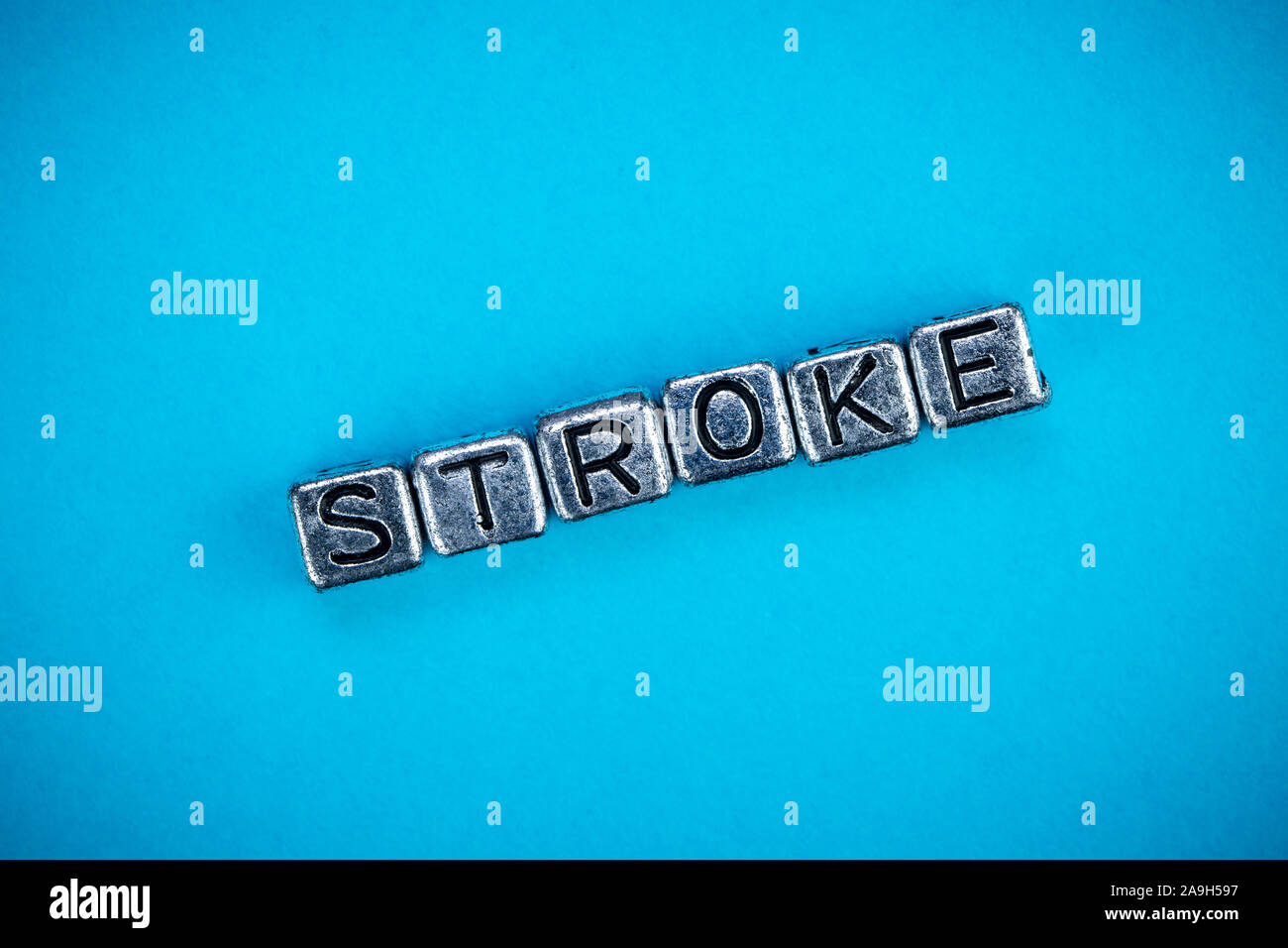 Stroke disease background concept represented by cubic metal letters ...
