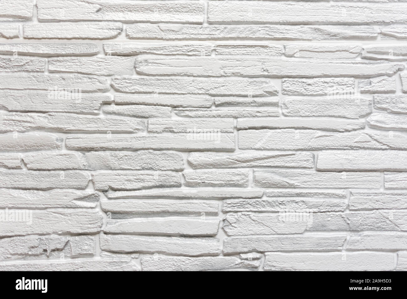 White stone wall background or texture. Construction industry. Home ...
