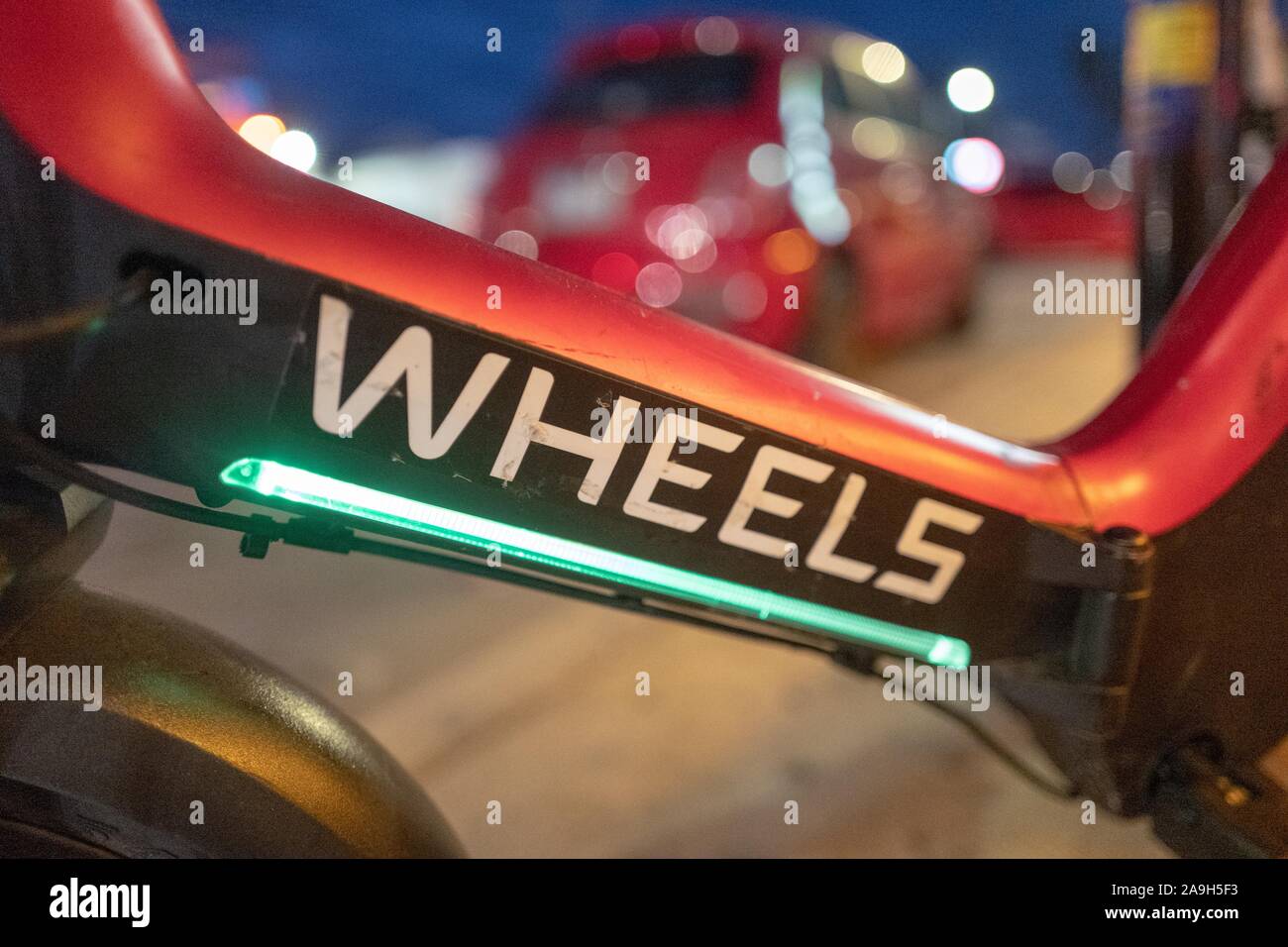 Close-up of logo on crosspiece of sharing economy rentable electric ...