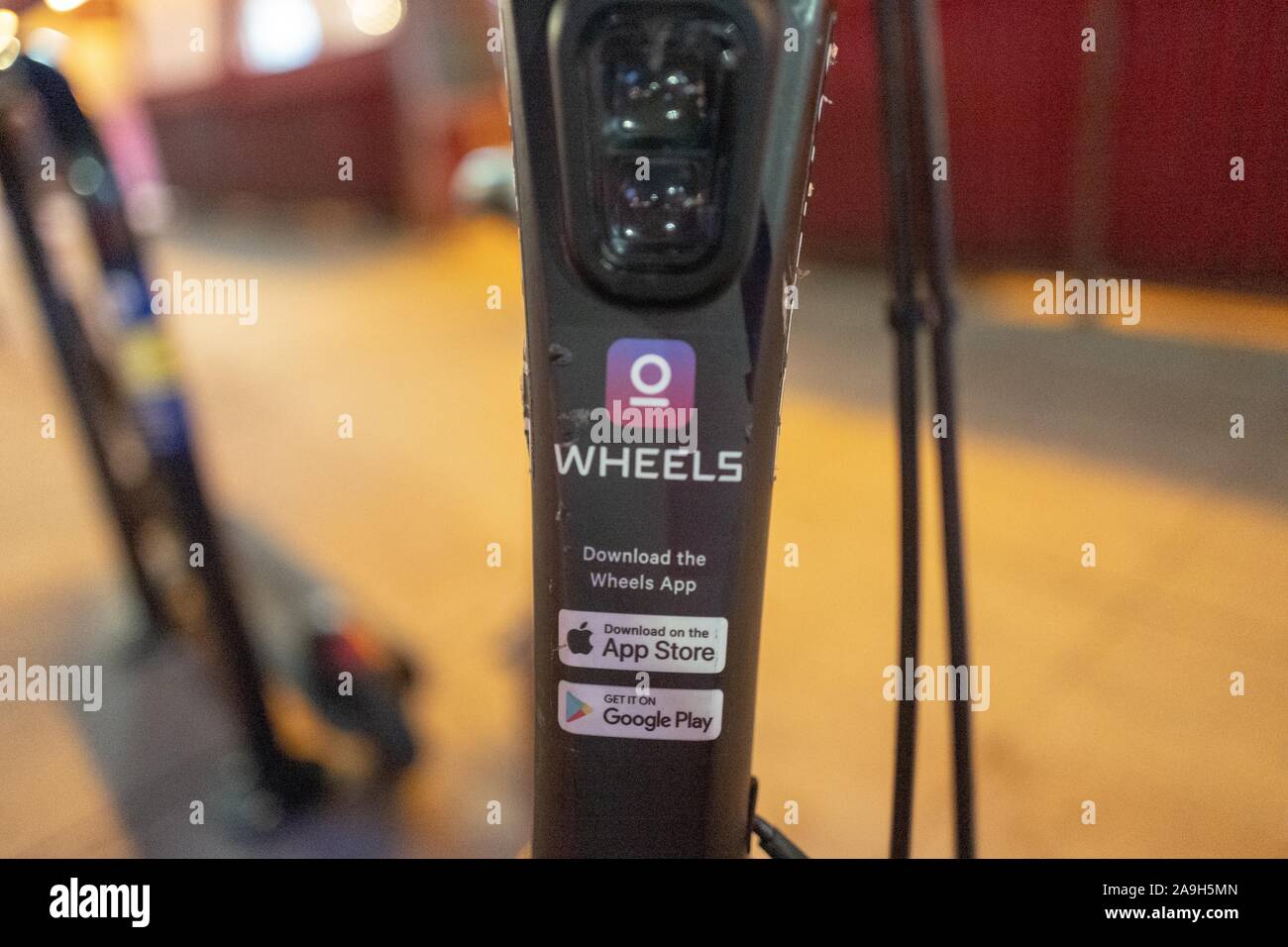 Close-up of logo on crosspiece of sharing economy rentable electric ...