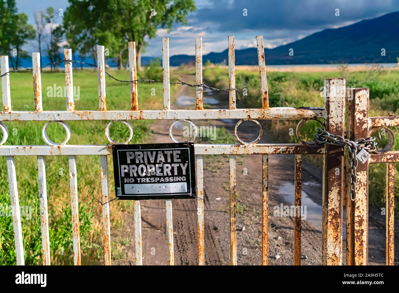 Private property locked gate sign on a gate with a hi-res stock ...