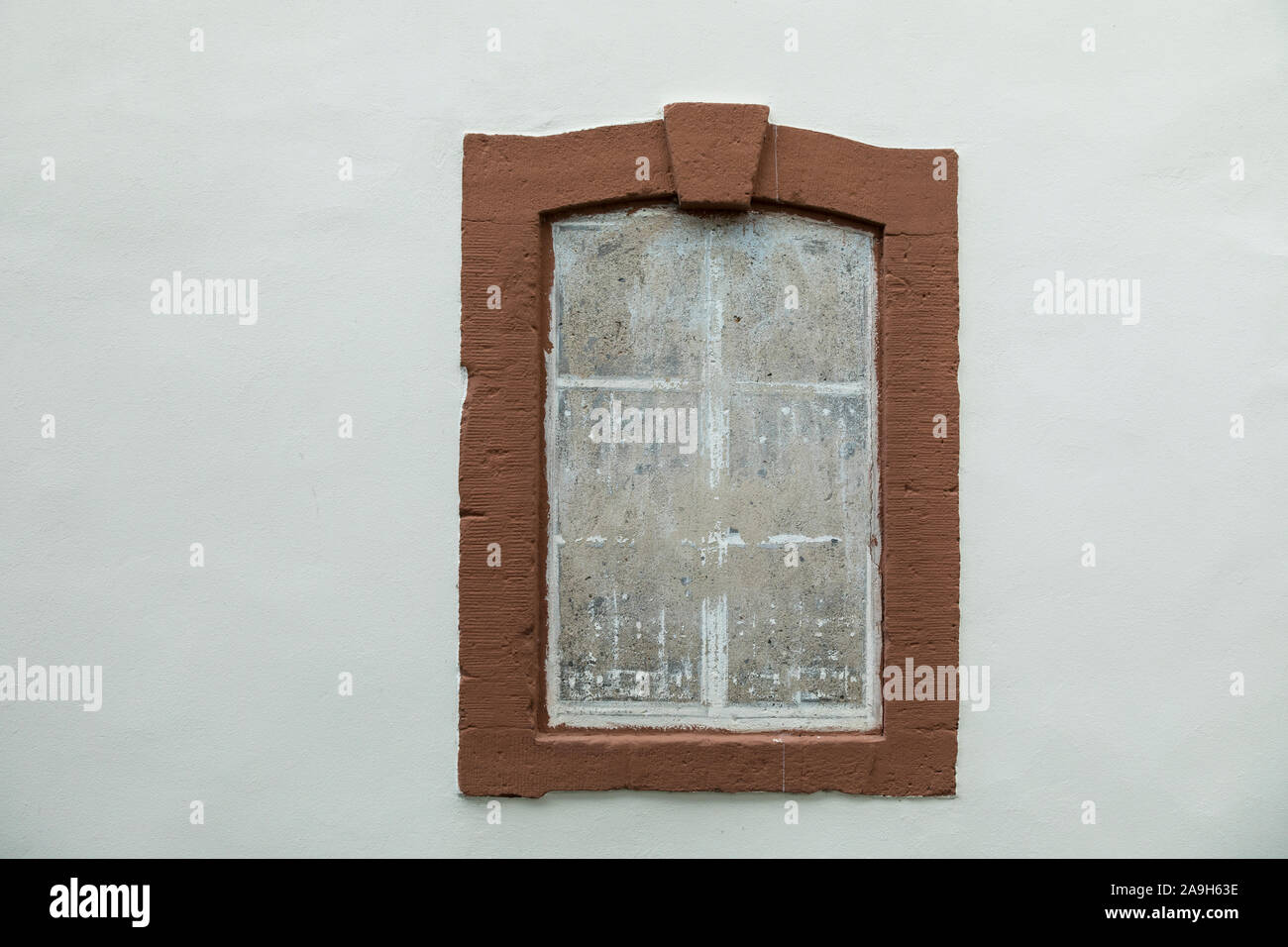 Blocked up outside window with faux glazing bars painted onto blockwork ...