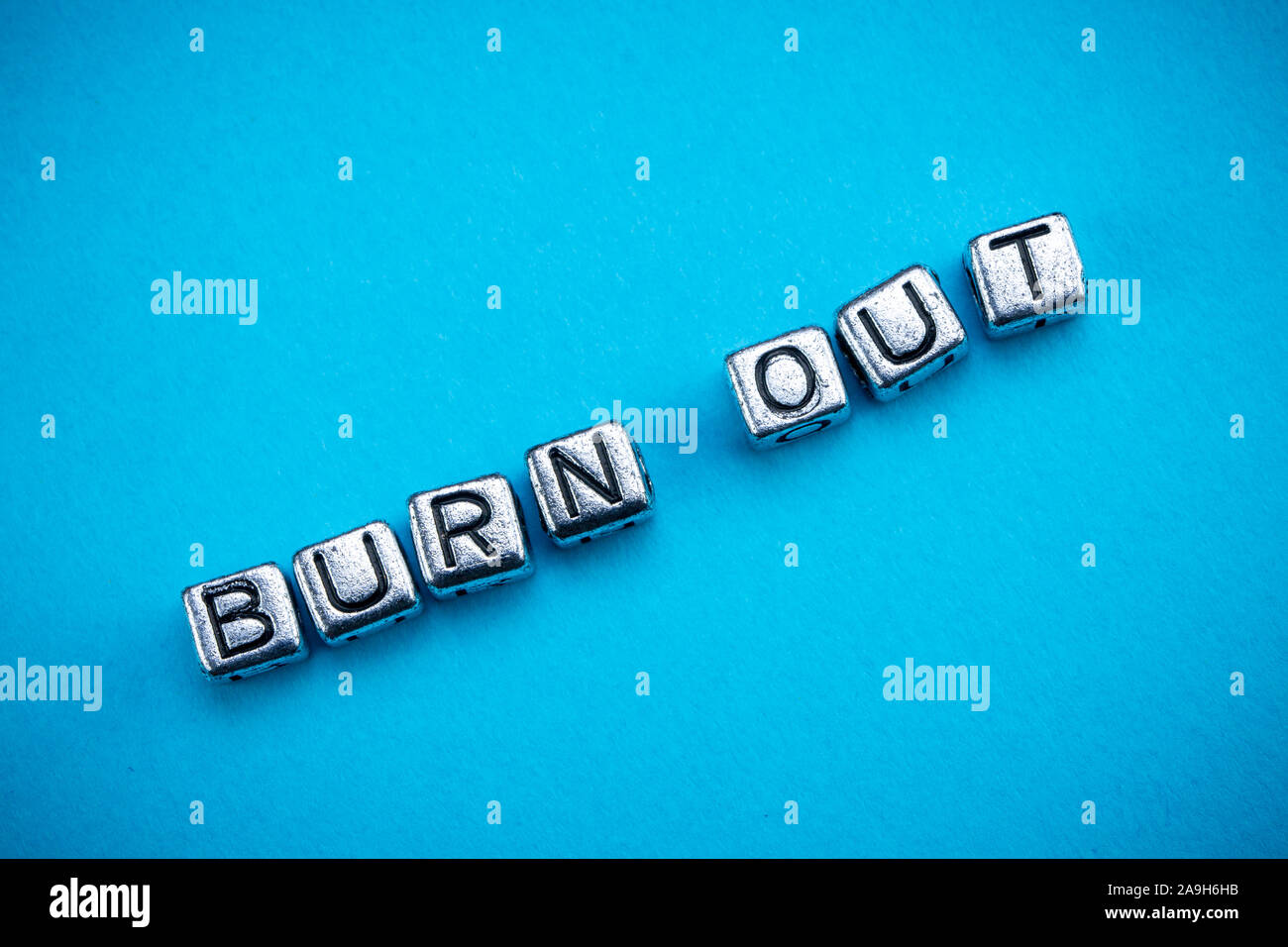 Burnout background concept represented by cubic metal letters Stock ...