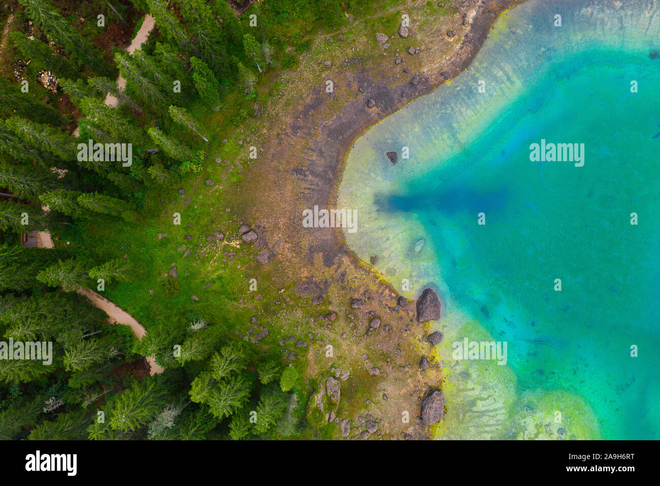 Aerial view of turquoise blue water of lake Carezza in Alps Dolomites ...