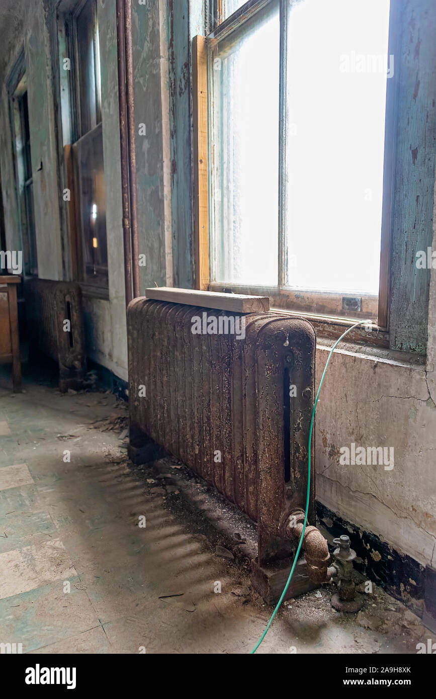 USA, New York, Ellis Island - May 2019: vintage cast iron radiator ...