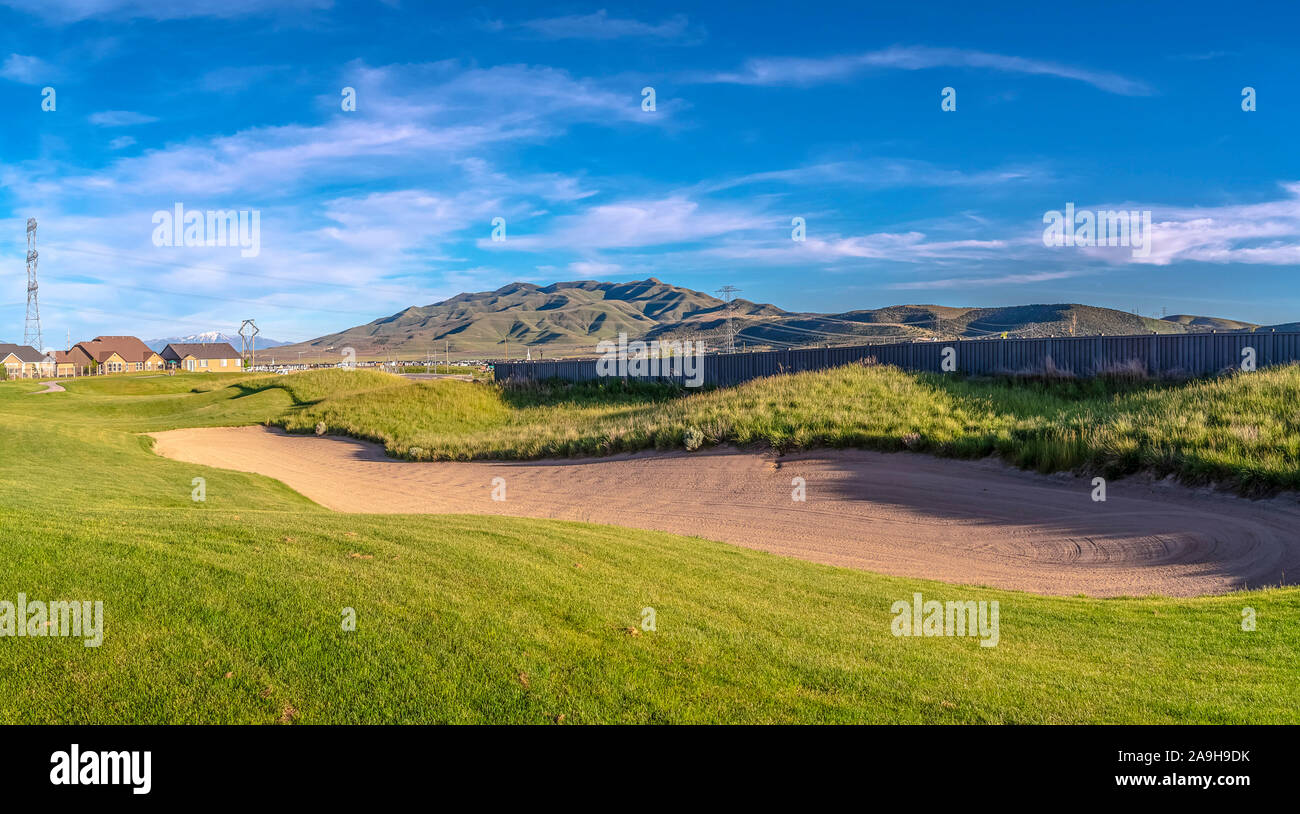 Long meandering sand trap on a golf course Stock Photo - Alamy