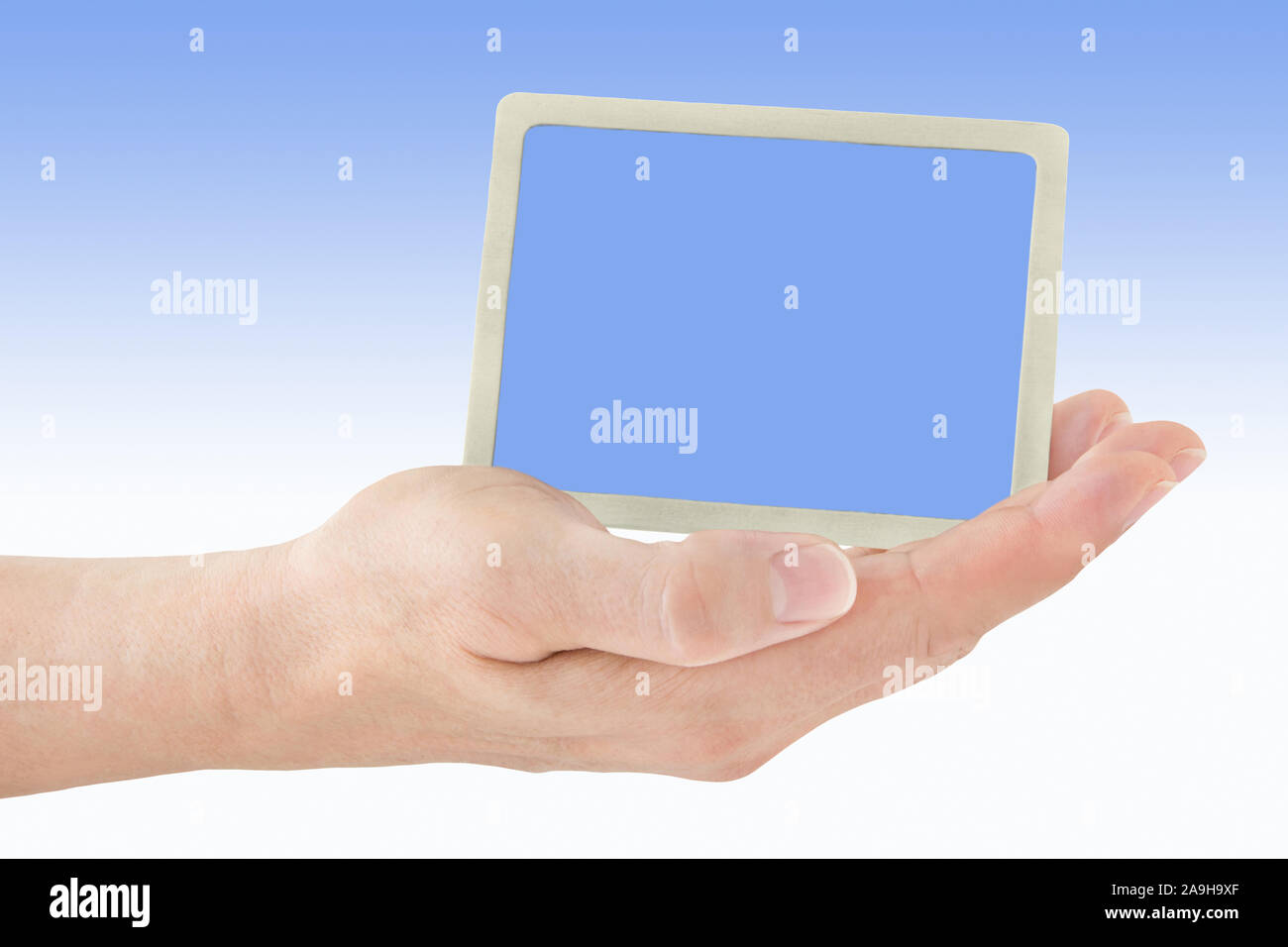 Male hand and blue label Stock Photo - Alamy