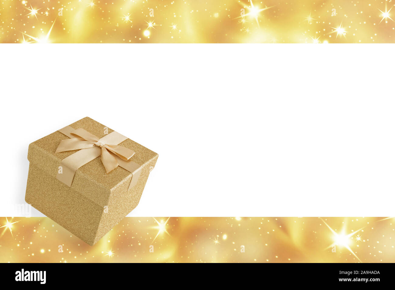Golden gift against white background Stock Photo - Alamy