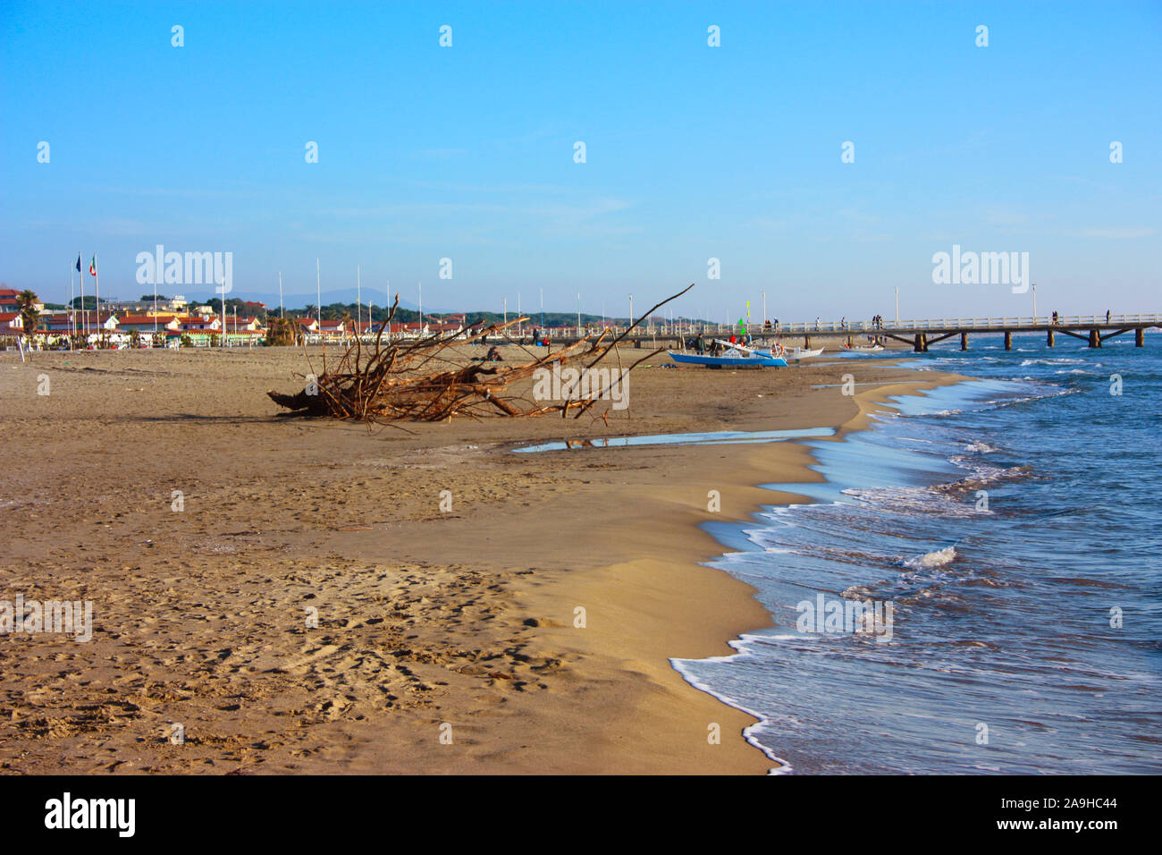 the Versilia beach, a sandy expanse of soft and warm colors in front of ...