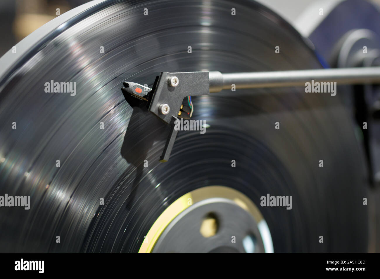 Vinyl record playing on a turntable. Close up view Stock Photo - Alamy