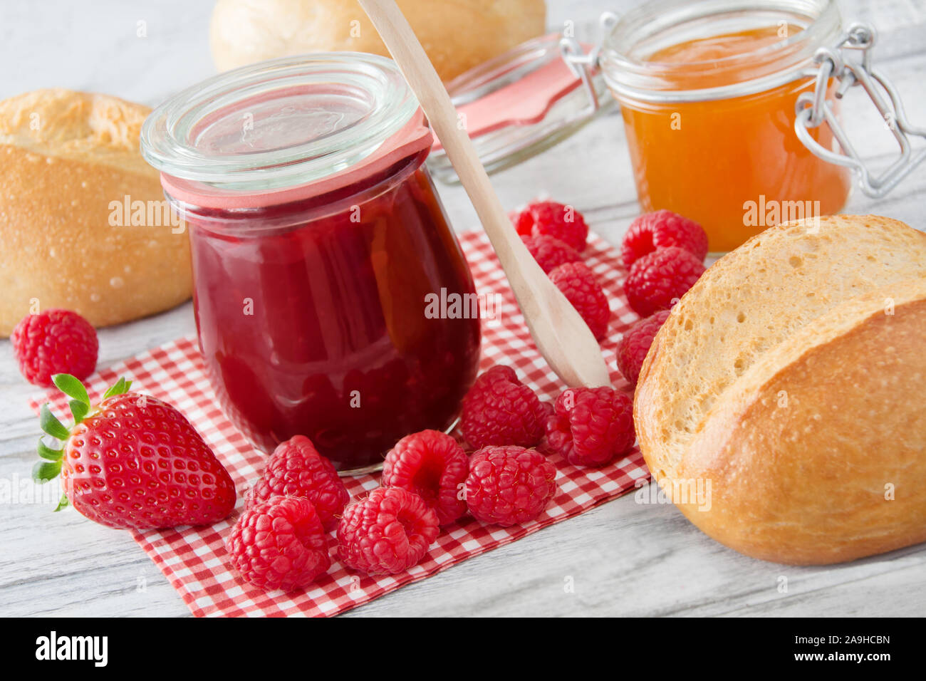 Fresh breakfast rolls and jam with berries Stock Photo - Alamy