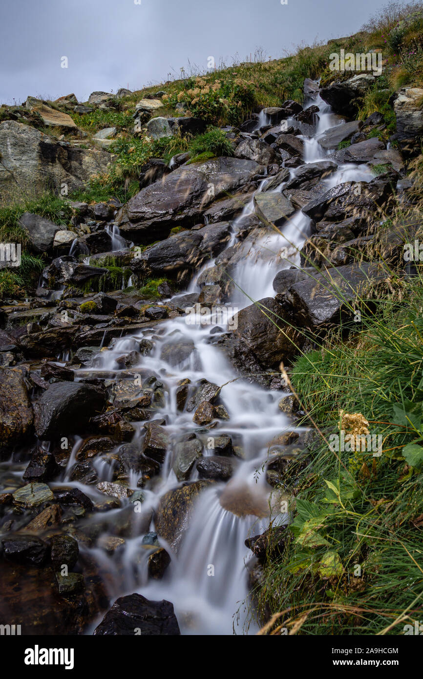 Water streaming down rocks Stock Photo - Alamy