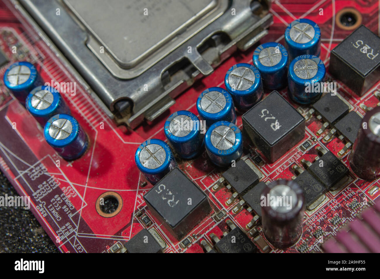 Close up of a processor and capacitors on a red motherboard Stock Photo ...