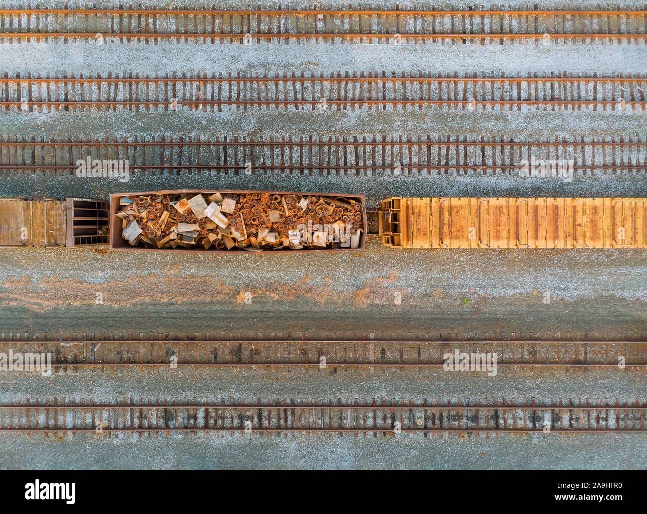 Old rusty corroded metal railway wagon with metal scrap for ecology ...