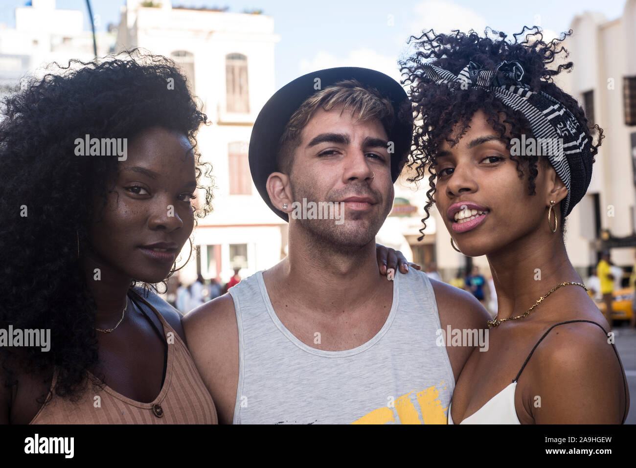 Three young people having fun Stock Photo - Alamy