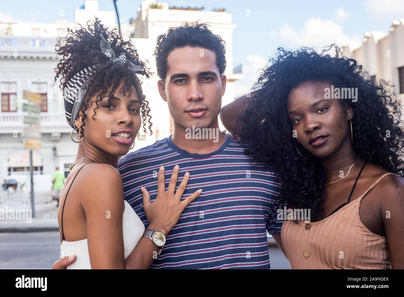 Three young people having fun Stock Photo - Alamy