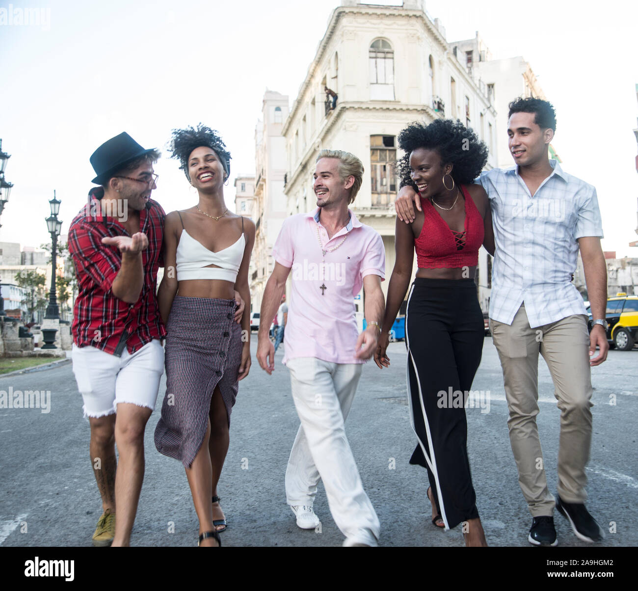Group of Latin friends walking on the street on the weekend Stock Photo ...