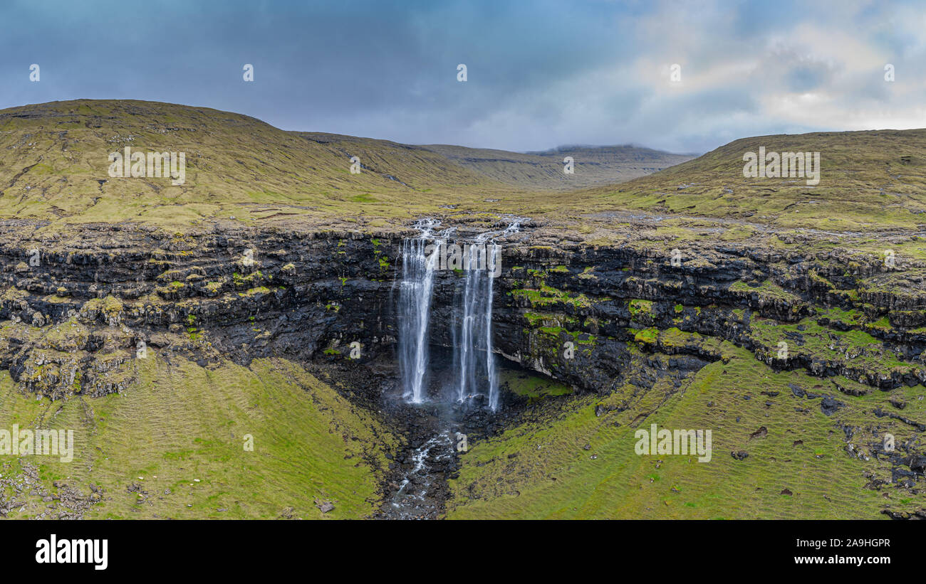 Aerial view of Fossa top side of double-tiered waterfall, Faroe Islands ...