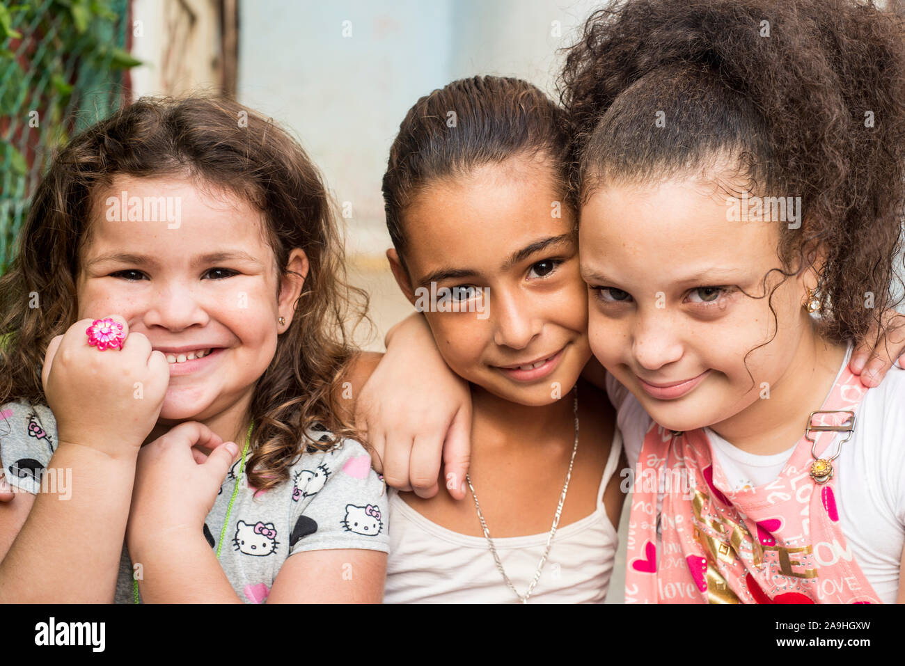 Three little friends looking camera hi-res stock photography and images ...