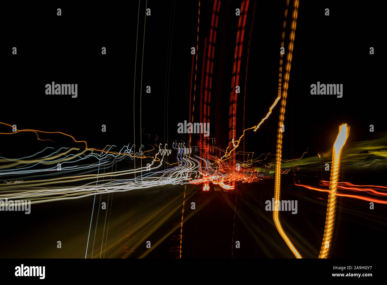 Perspective view of light blue illuminated high speed urban road moving ...
