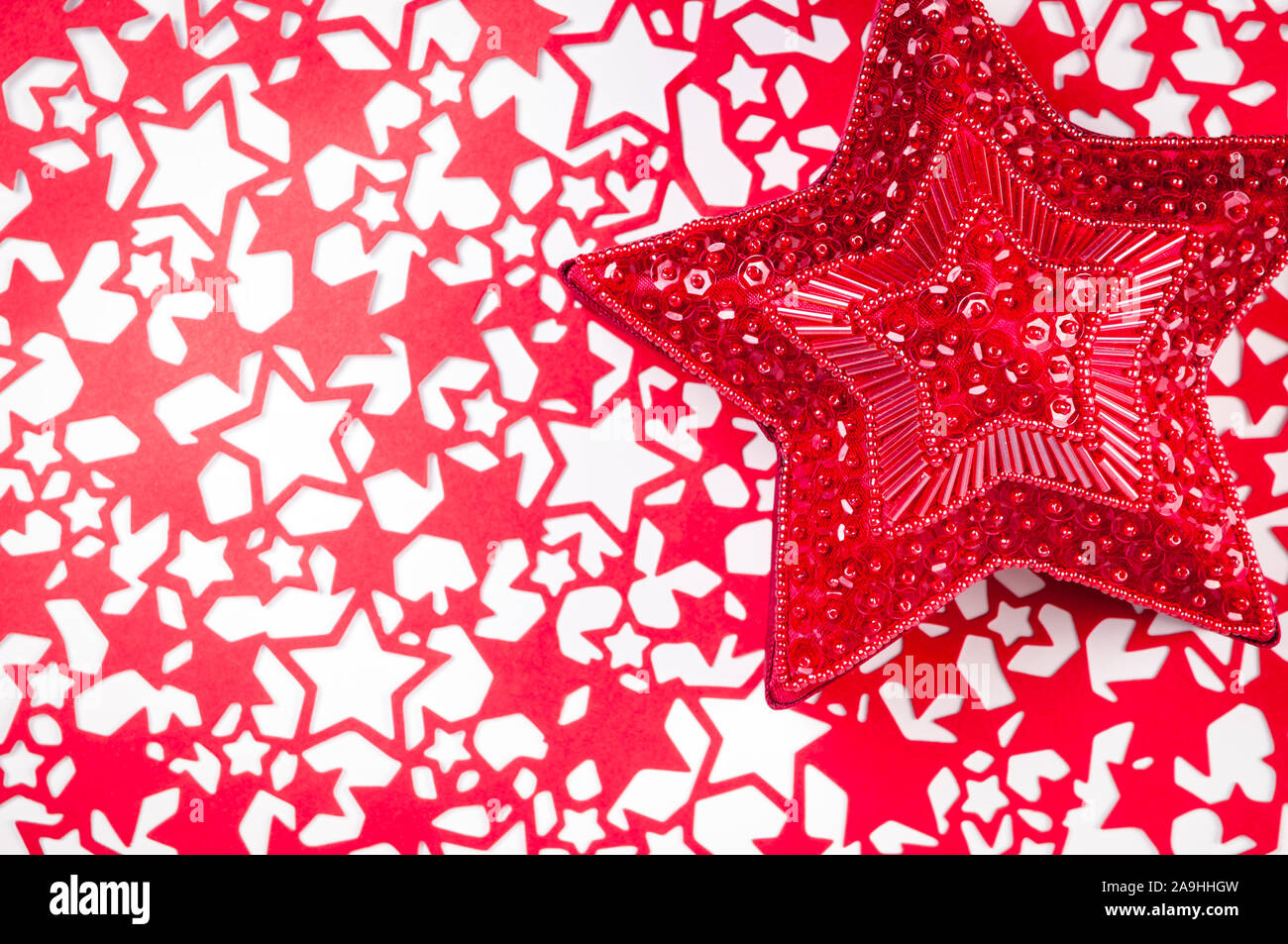 Sparkling star shaped gift box on abstract red background of ...
