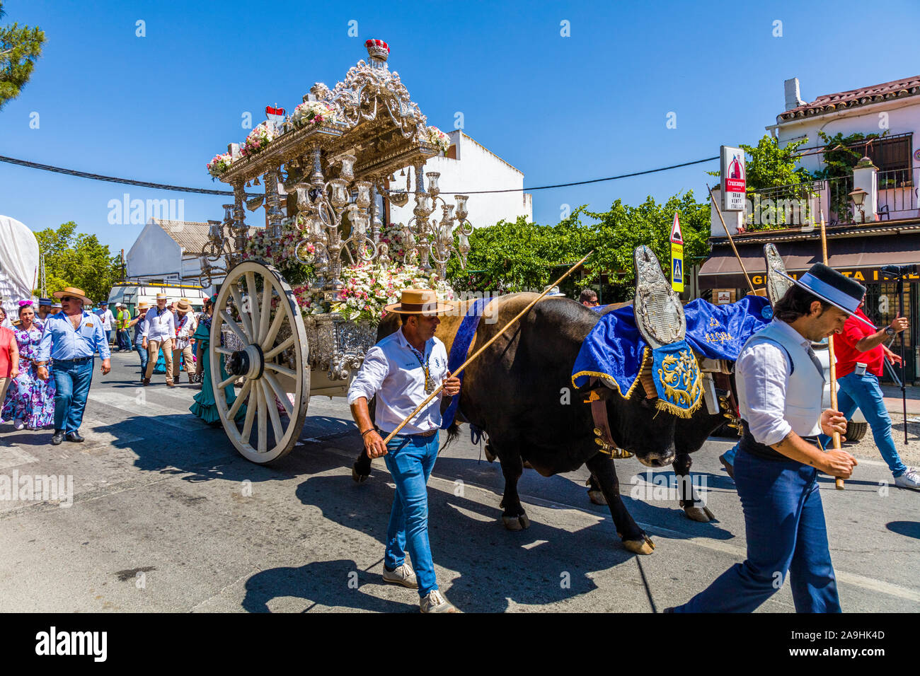 The Romería de El Rocío or El Rocío pilgrimage passing though the town ...