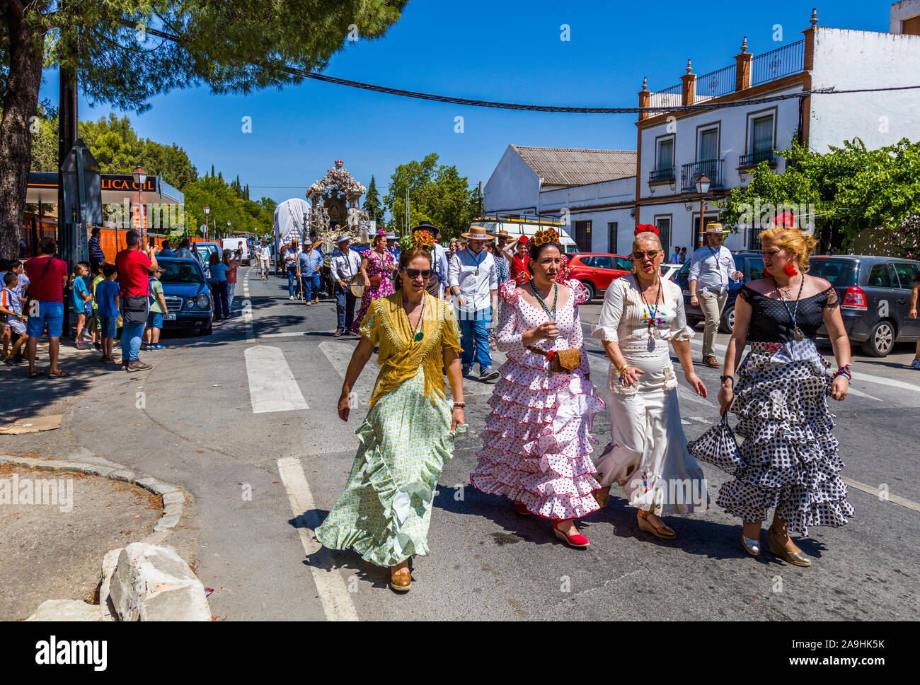 The Romería de El Rocío or El Rocío pilgrimage passing though the town ...