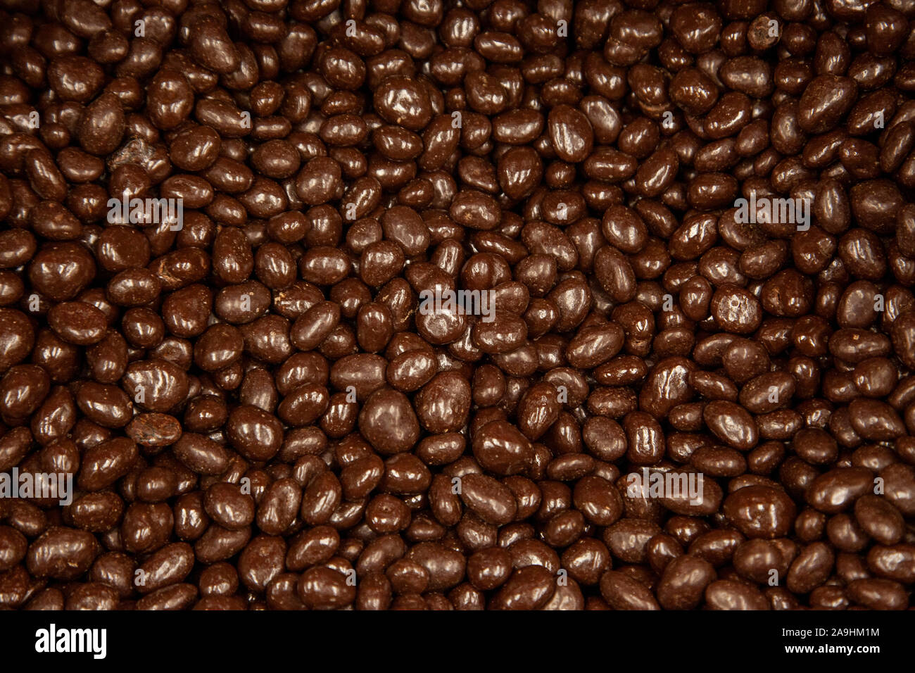 a tasty sugary snack, raisins covered in chocolate coating Stock Photo ...