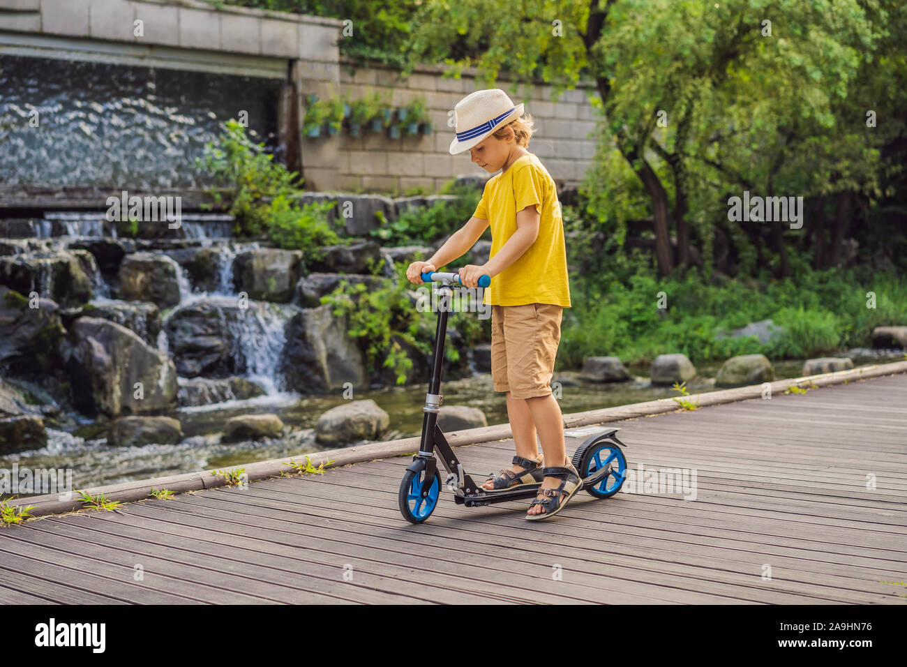 Boy on scooter in Seoul Cheonggyecheon stream. Cheonggyecheon stream is ...