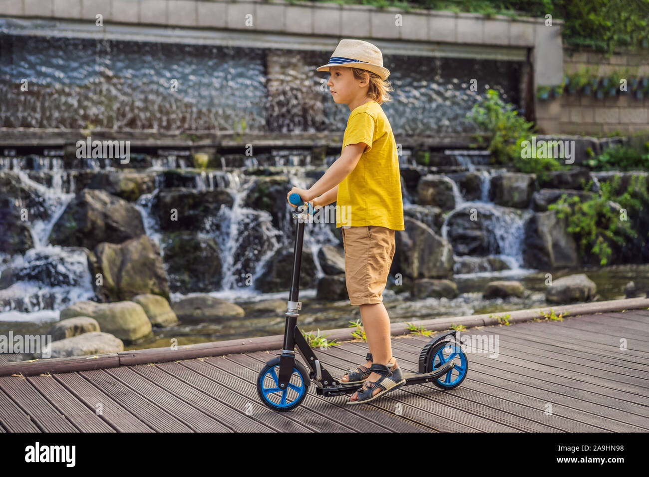 Boy on scooter in Seoul Cheonggyecheon stream. Cheonggyecheon stream is ...