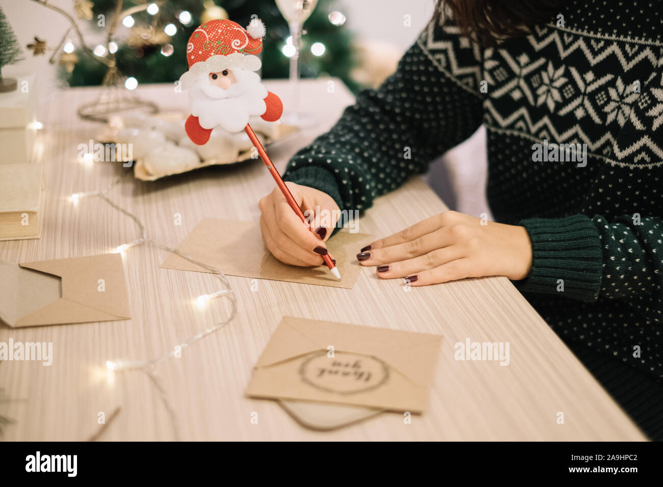 Womans hand decorating xmas tree hi-res stock photography and images ...