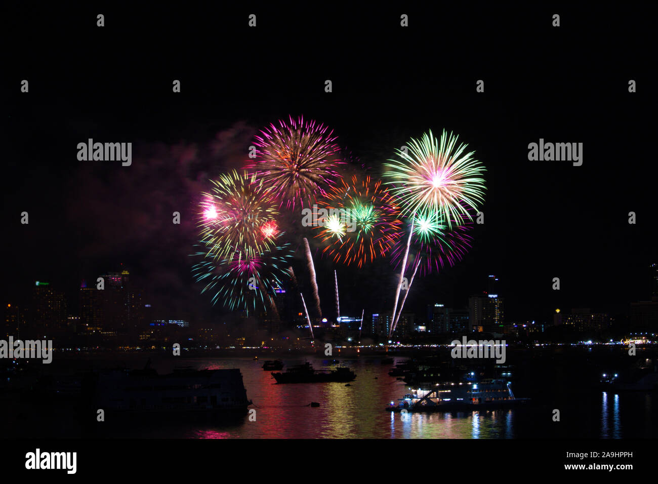 Pattaya city thailand fireworks on beach and reflection color on water ...