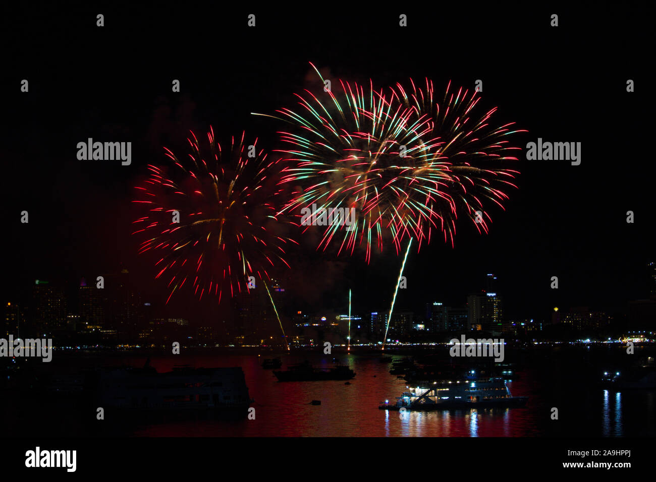 Pattaya city thailand fireworks on beach and reflection color on water ...