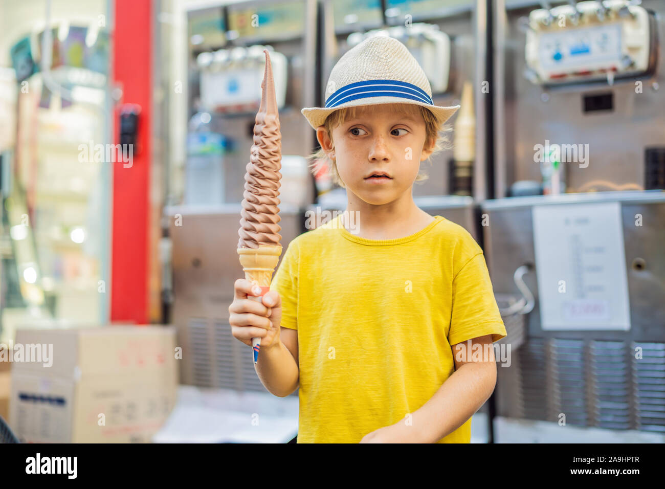 Little tourist boy eating 32 cm ice cream. 1 foot long ice cream. Long ...